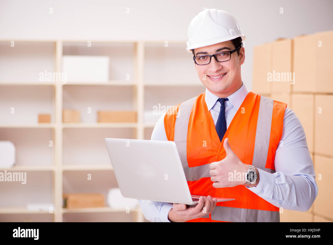 Man working in postal parcel delivery service office Stock Photo - Alamy