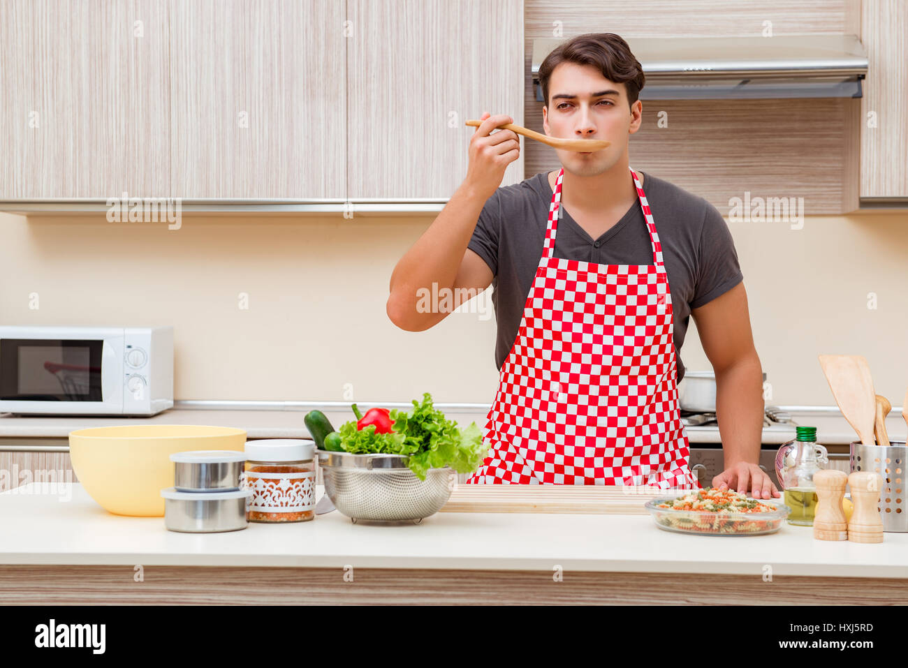 Man male cook preparing food in kitchen Stock Photo - Alamy