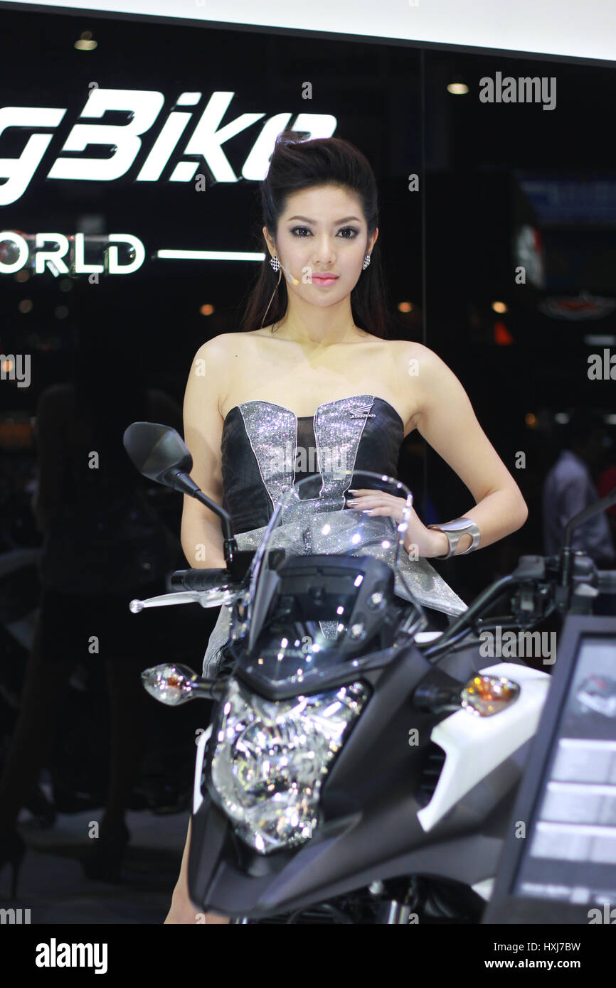 BANGKOK, THAILAND - MARCH 30, 2014: Unidentified female presenter pose ...