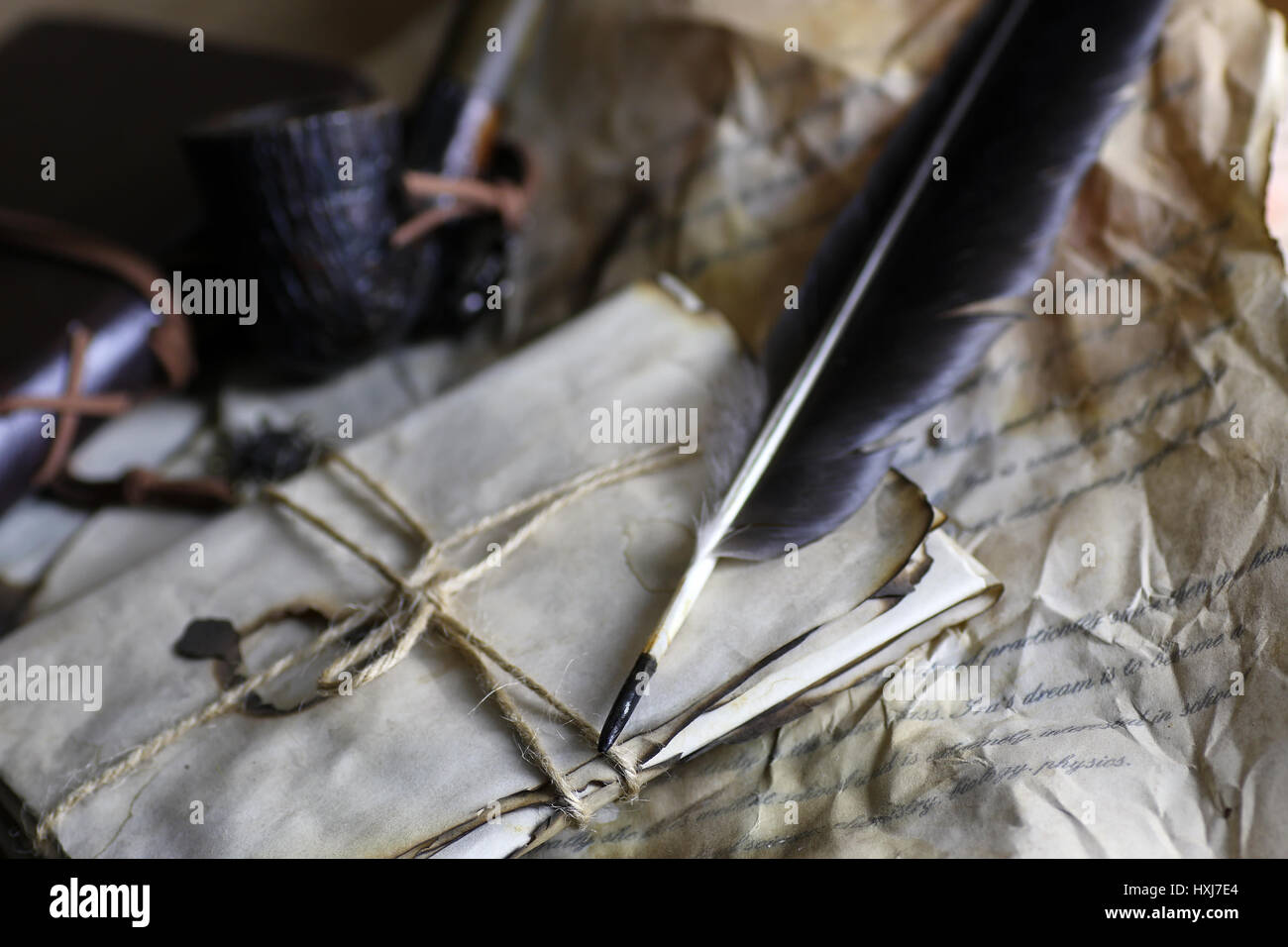 old paper letter feather Stock Photo - Alamy
