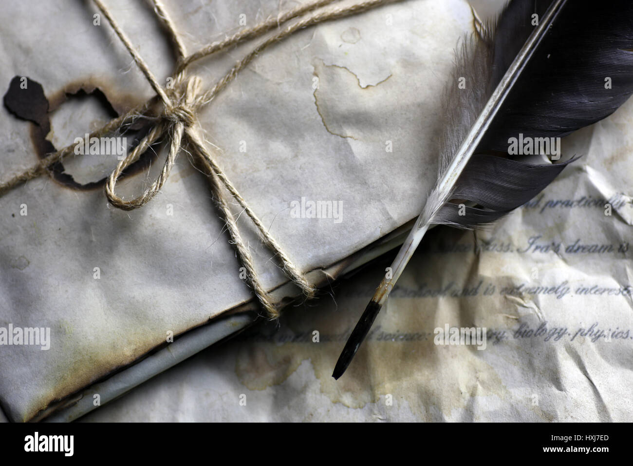 old paper letter feather Stock Photo - Alamy