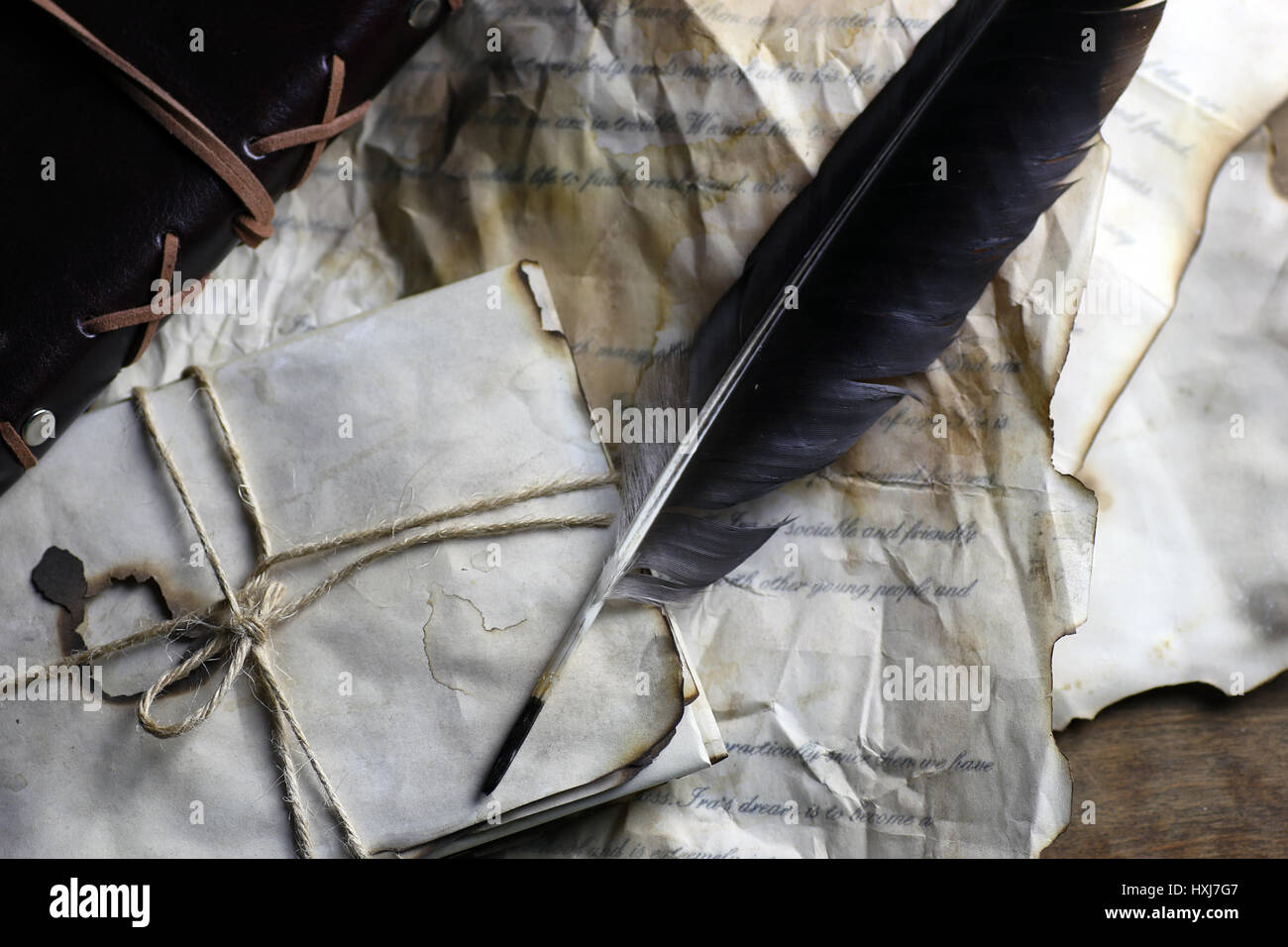 old paper letter feather Stock Photo - Alamy
