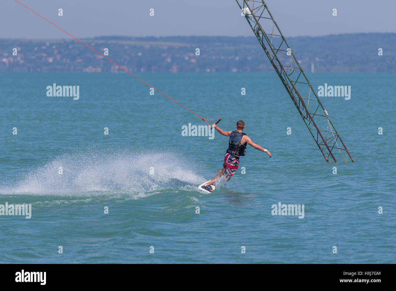 young men wakeboarding Stock Photo - Alamy