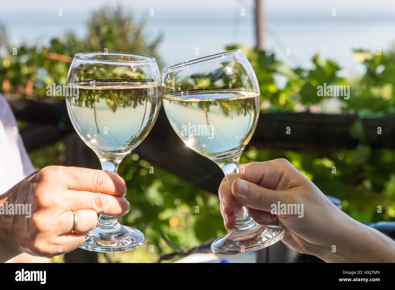 Wine glass holding hands hi-res stock photography and images - Alamy