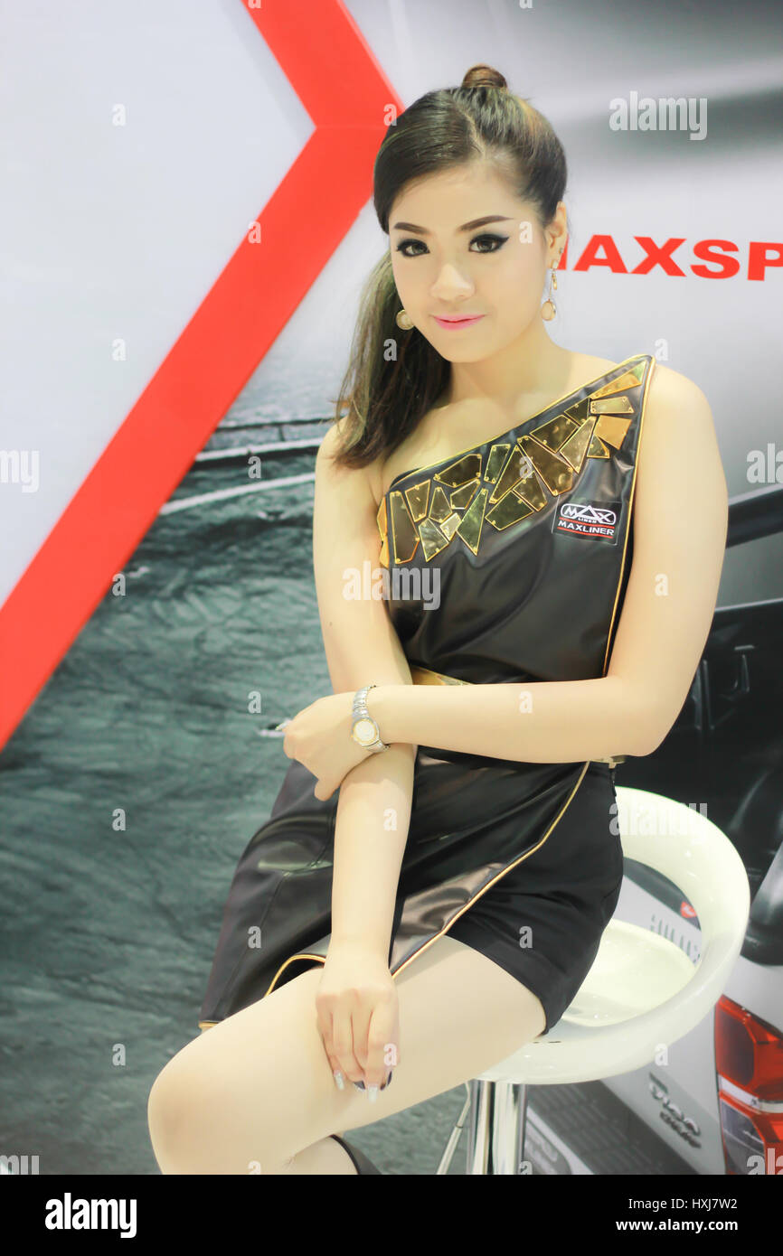 BANGKOK, THAILAND - MARCH 30, 2014: Unidentified female presenter pose ...