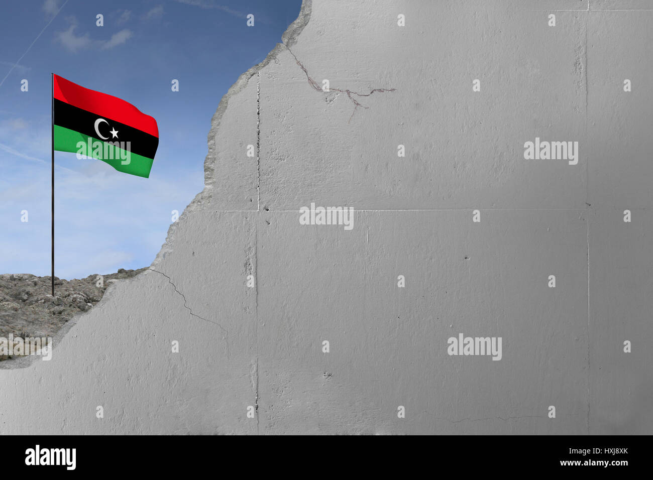 Libyan flag behind a concrete wall Stock Photo - Alamy