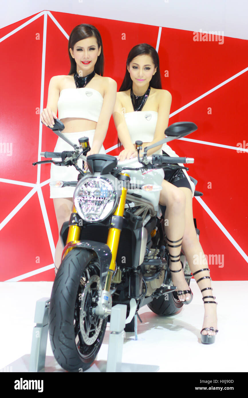 BANGKOK, THAILAND - MARCH 30, 2014: Unidentified female presenter pose ...