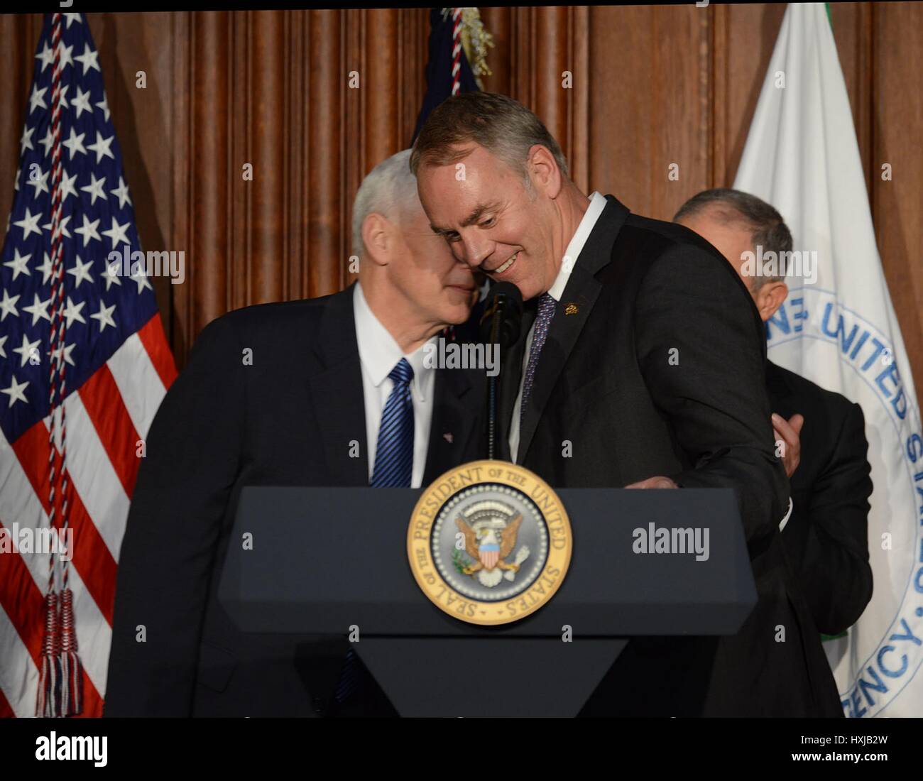 U.S. Vice President Mike Pence whispers to Interior Secretary Ryan ...