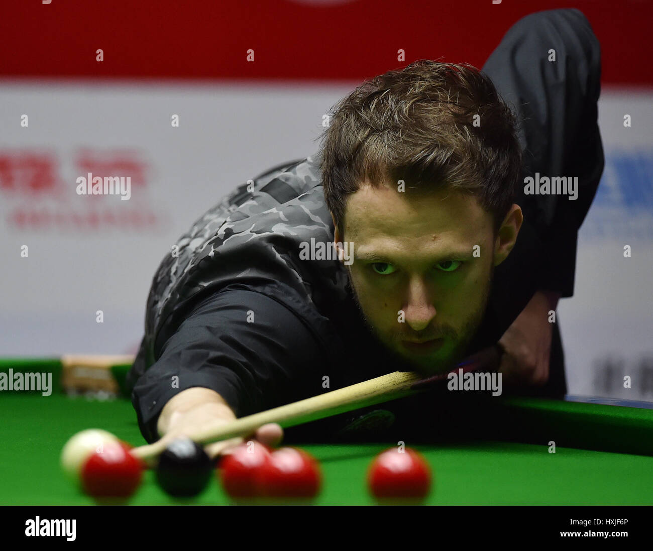 Beijing, China. 29th Mar, 2017. Judd Trump of England competes during ...