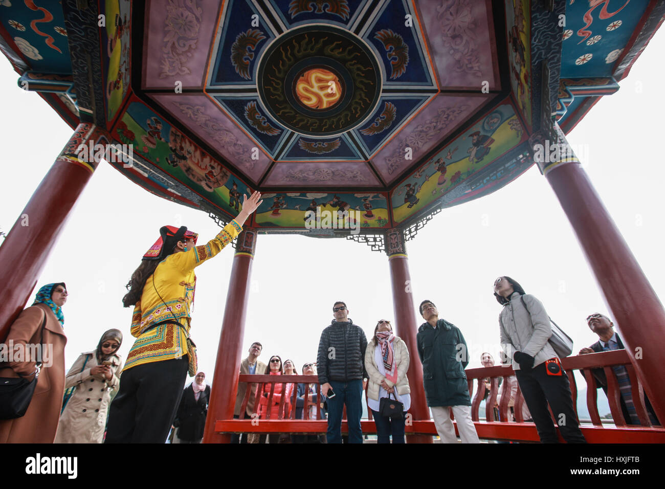 Bijie, China's Guizhou Province. 28th Mar, 2017. A tourist guide gives ...