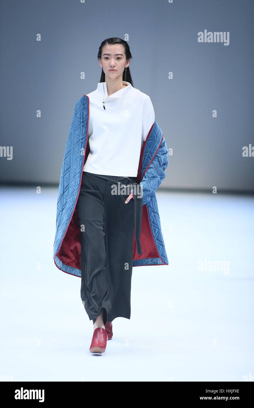 Beijing, China. 29th Mar, 2017. A model presents a creation of Chinese ...
