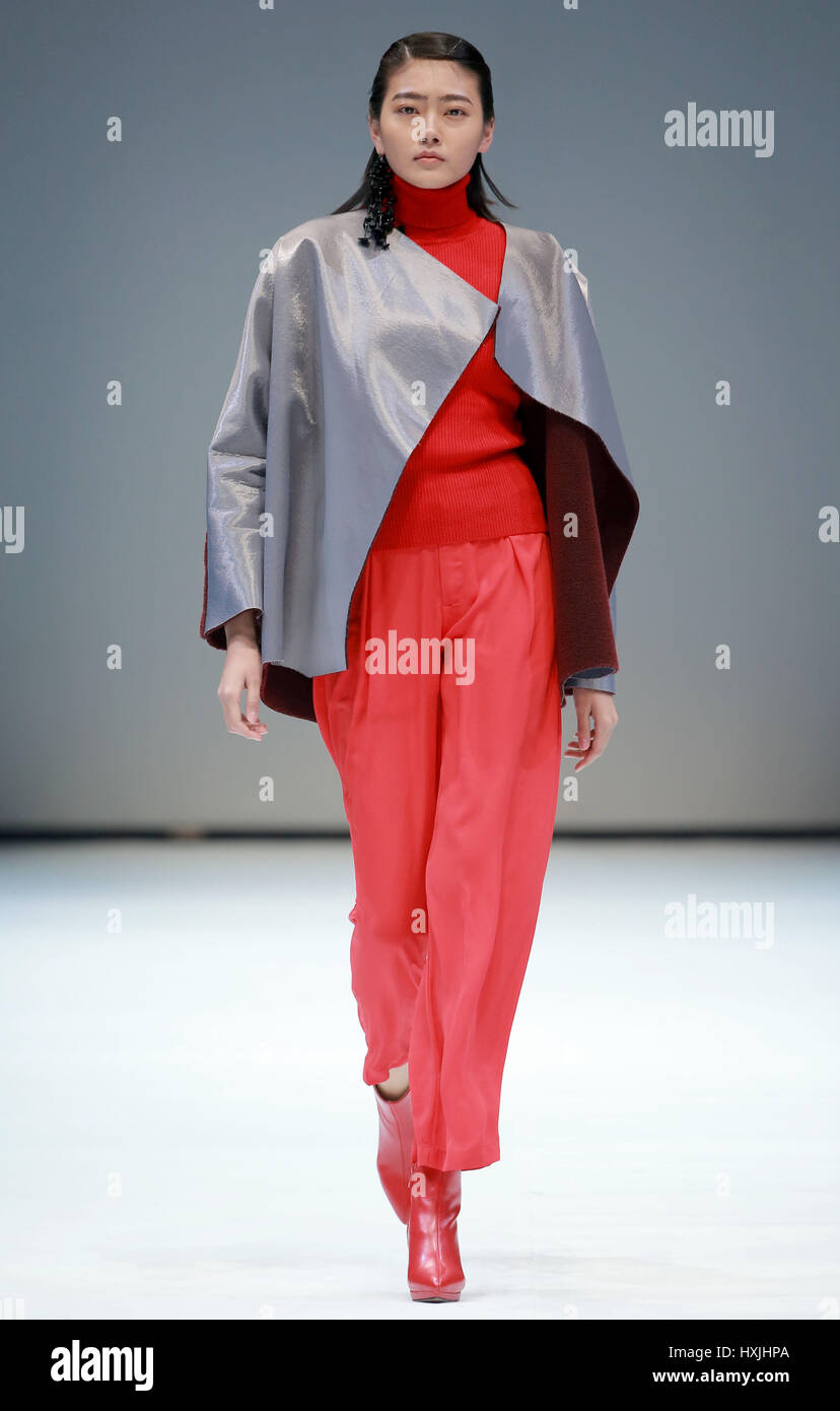 Beijing, China. 29th Mar, 2017. A model presents a creation by Han ...