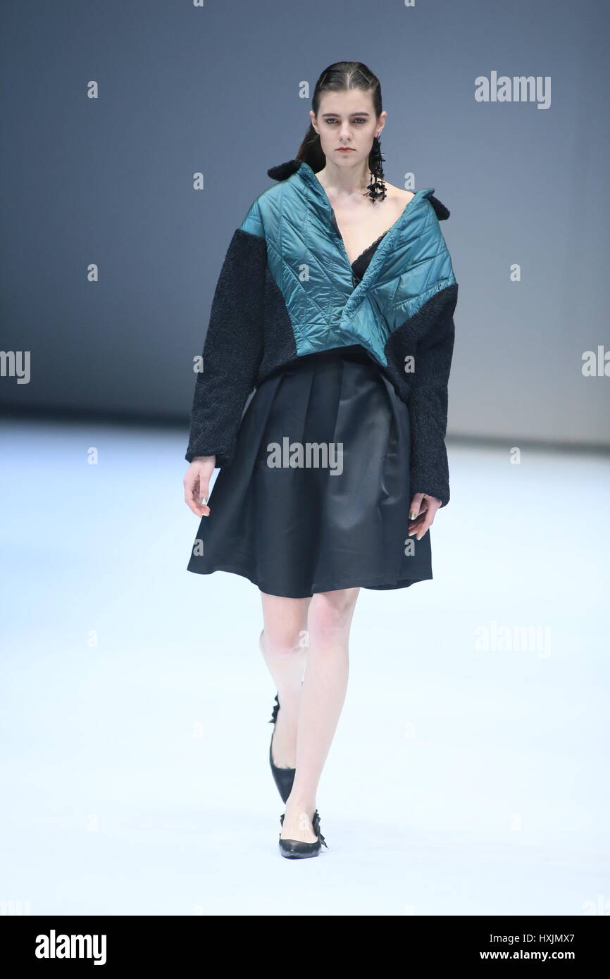 Beijin, Beijin, China. 29th Mar, 2017. A model presents a creation of ...