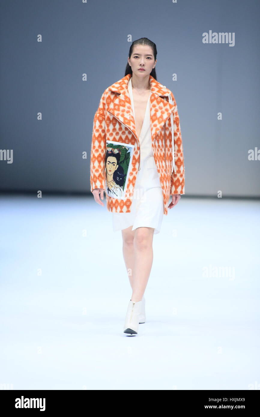Beijin, Beijin, China. 29th Mar, 2017. A model presents a creation of ...