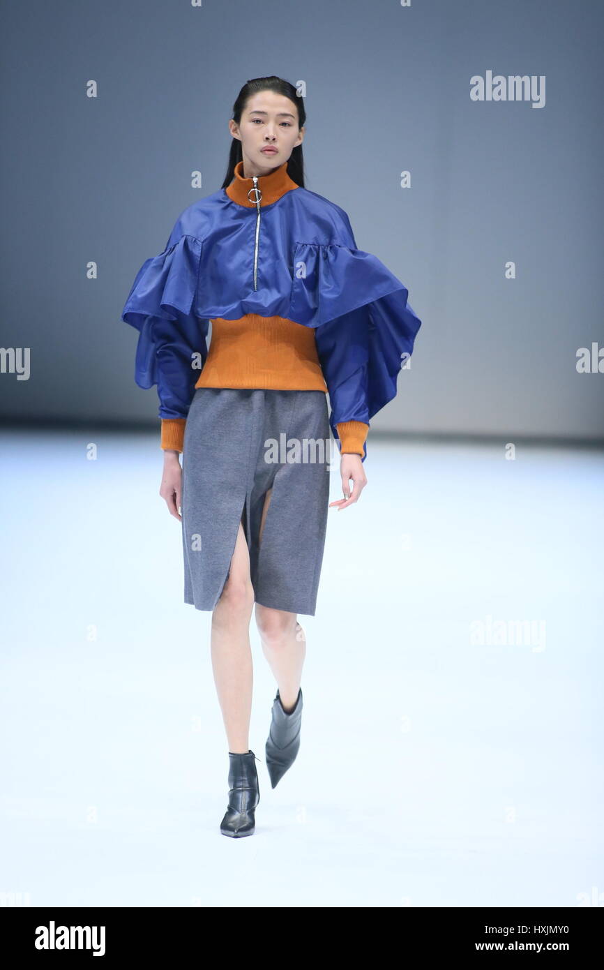 Beijin, Beijin, China. 29th Mar, 2017. A model presents a creation of ...