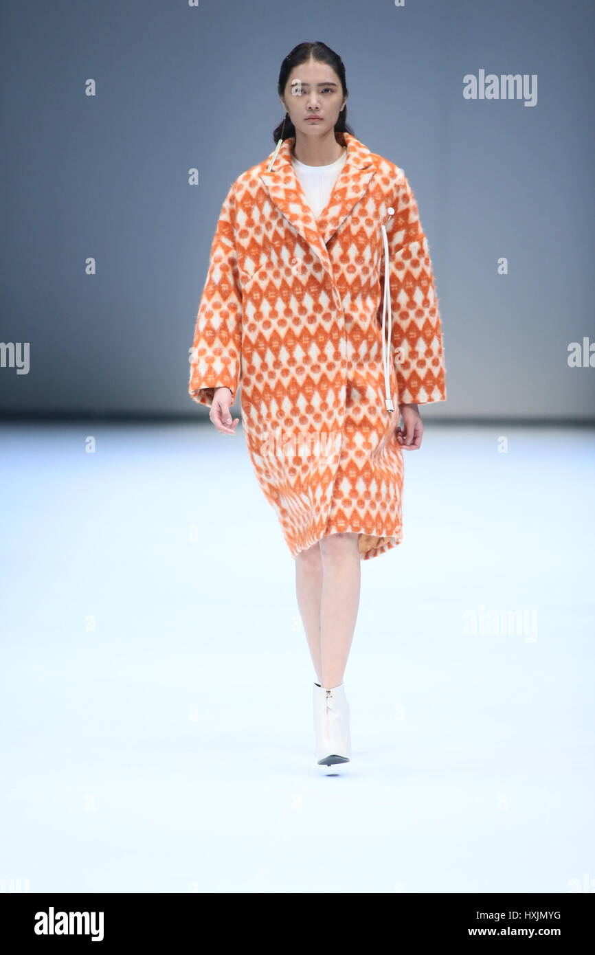 Beijin, Beijin, China. 29th Mar, 2017. A model presents a creation of ...