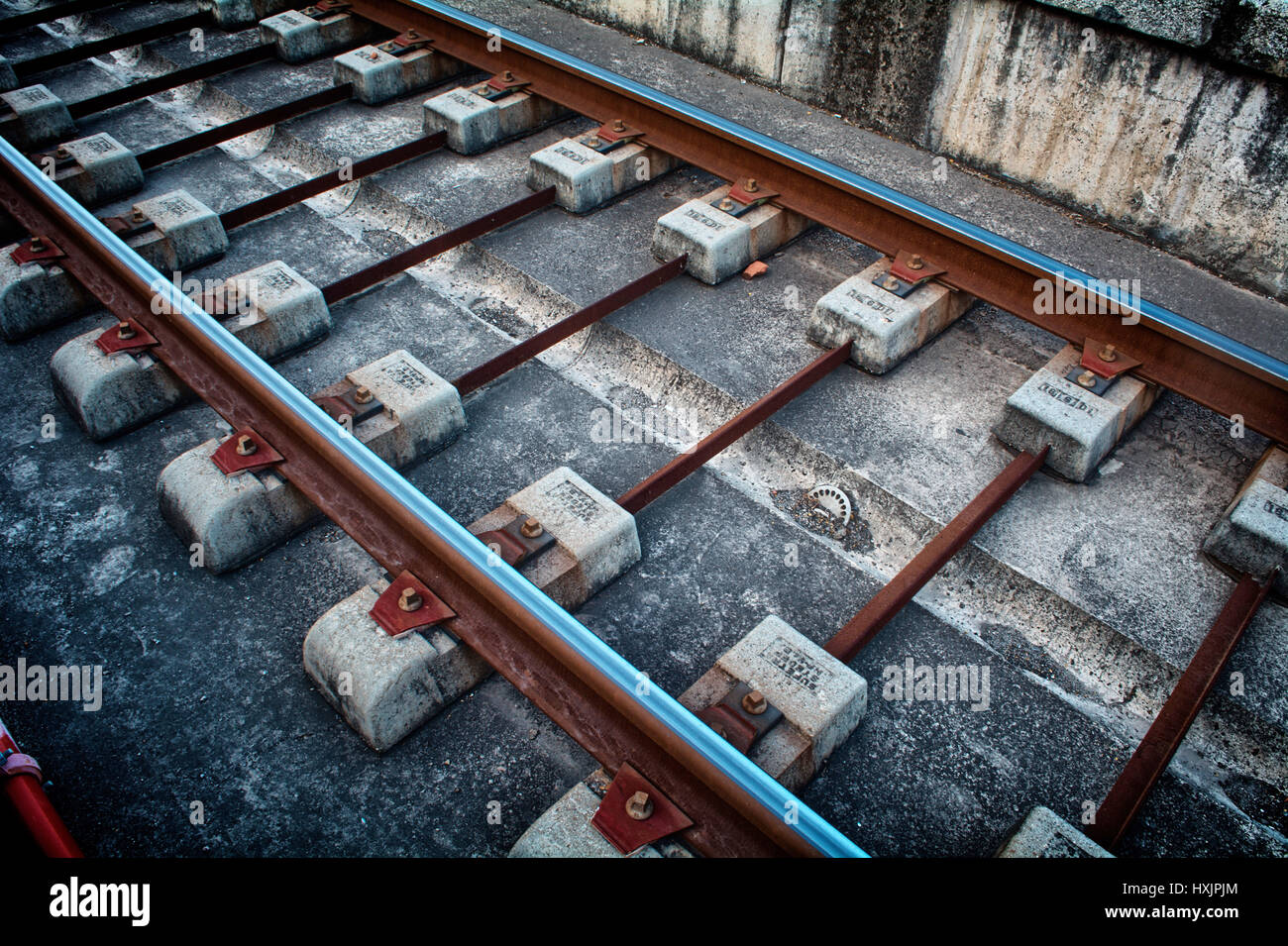 Station train tracks Stock Photo - Alamy