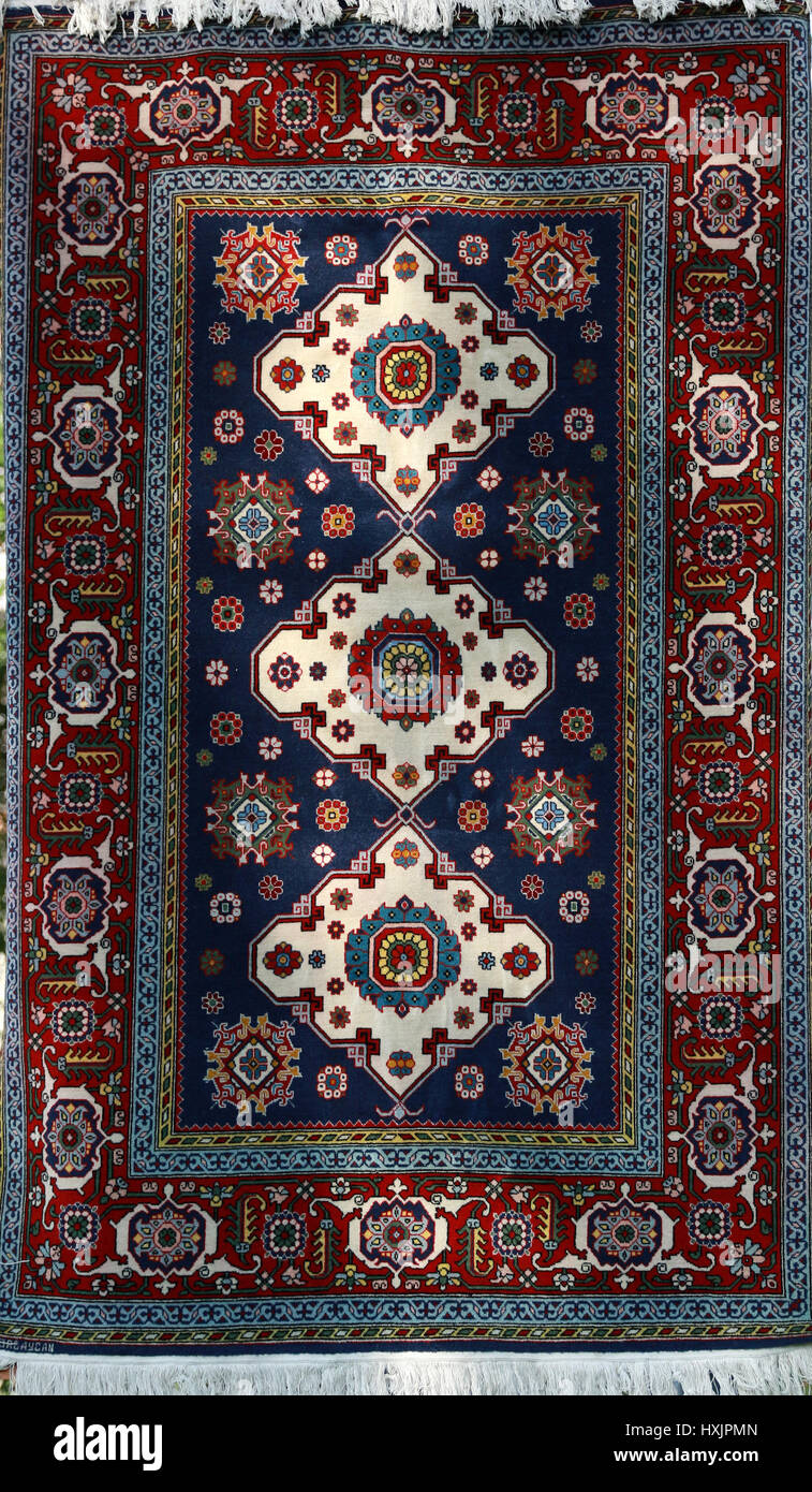 Hand-woven carpet with ethnic and folk pattern Stock Photo - Alamy