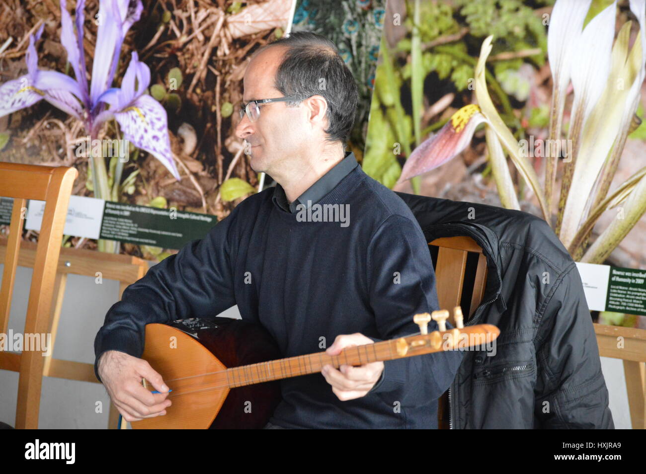 Ankara, Turkey. 28th Mar, 2017. Man plays baglama, Turkic stringed ...