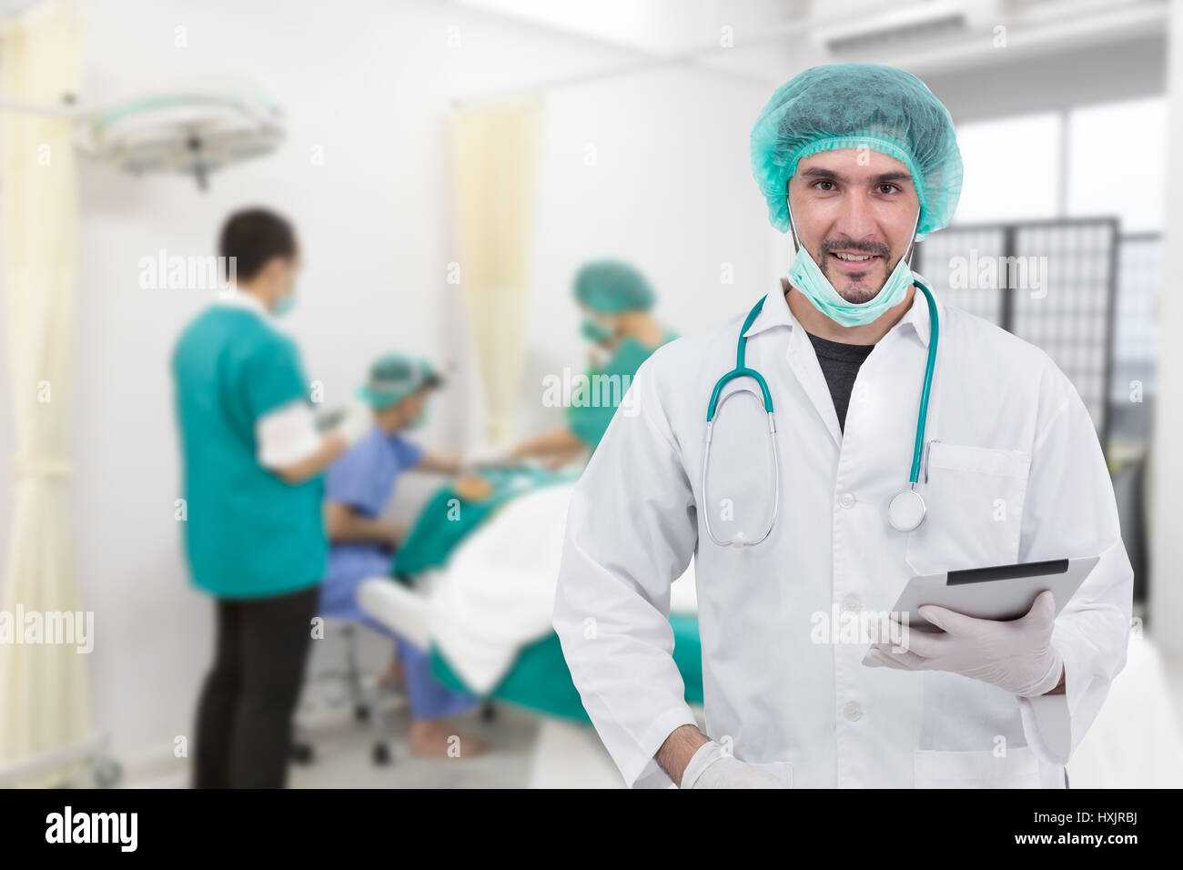 Male surgeon using digital tablet hi-res stock photography and images ...
