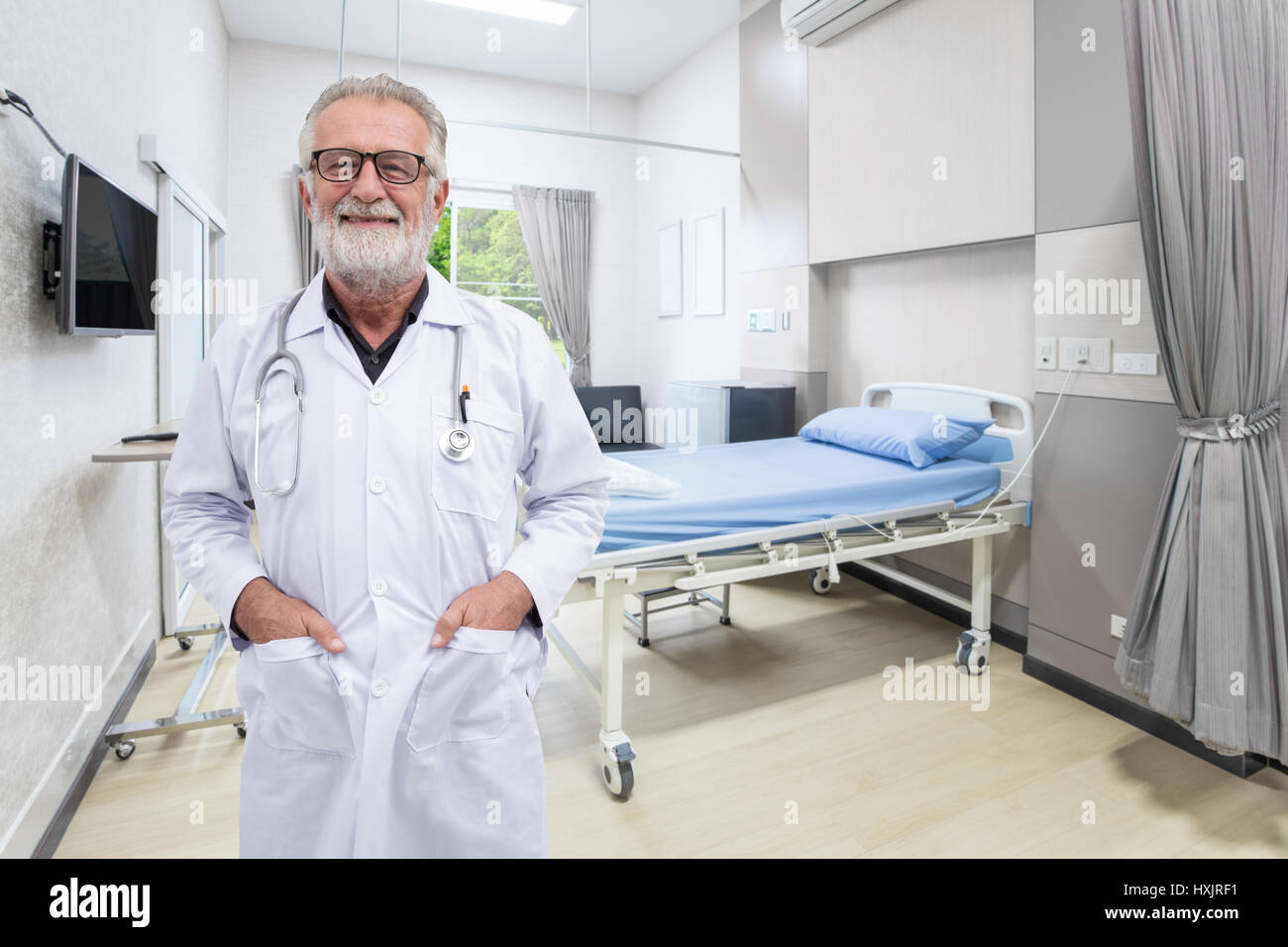 Senior doctor smile in the hospital room Stock Photo - Alamy