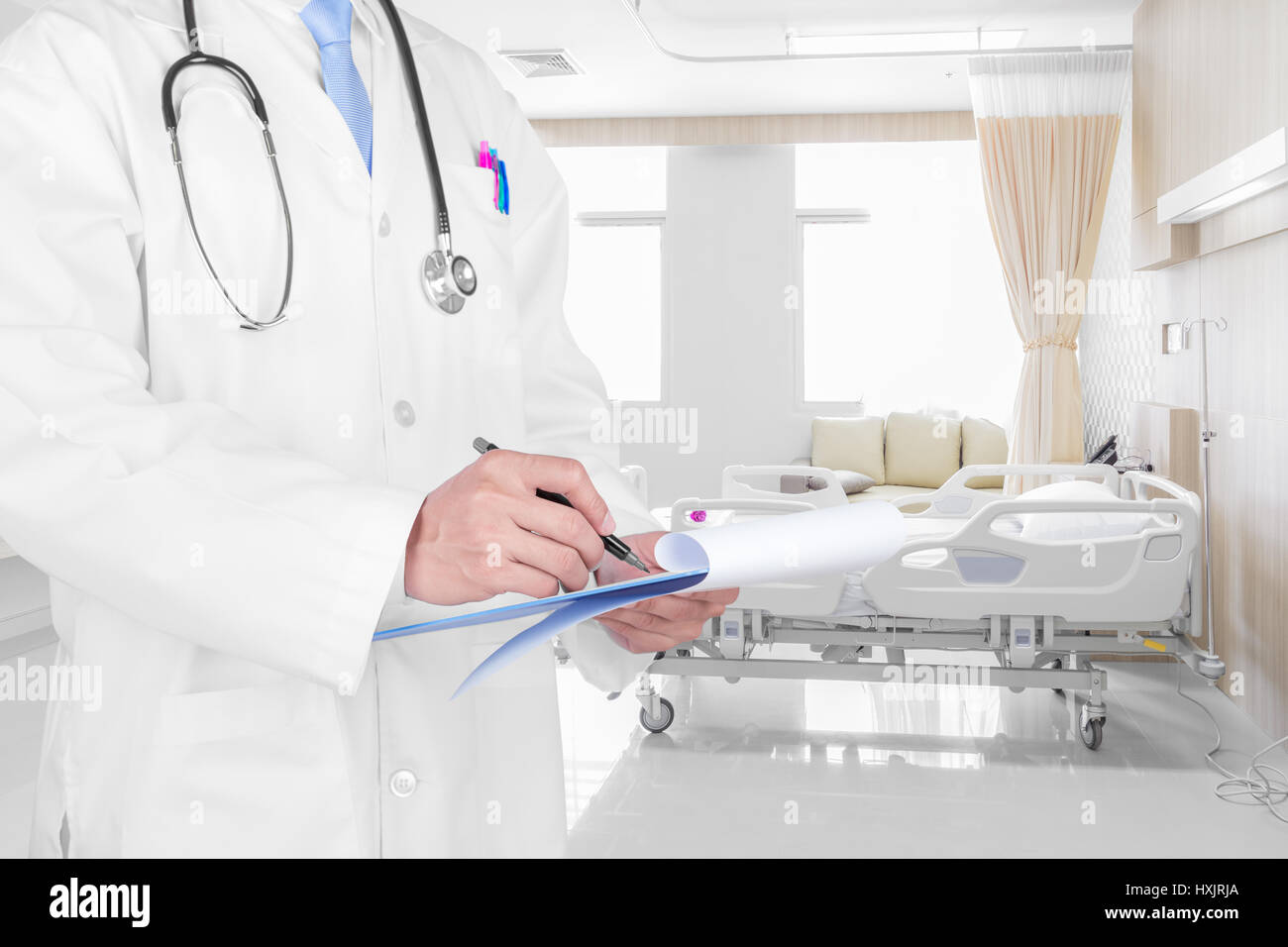 Doctor writing a medical prescription with medical background Stock ...