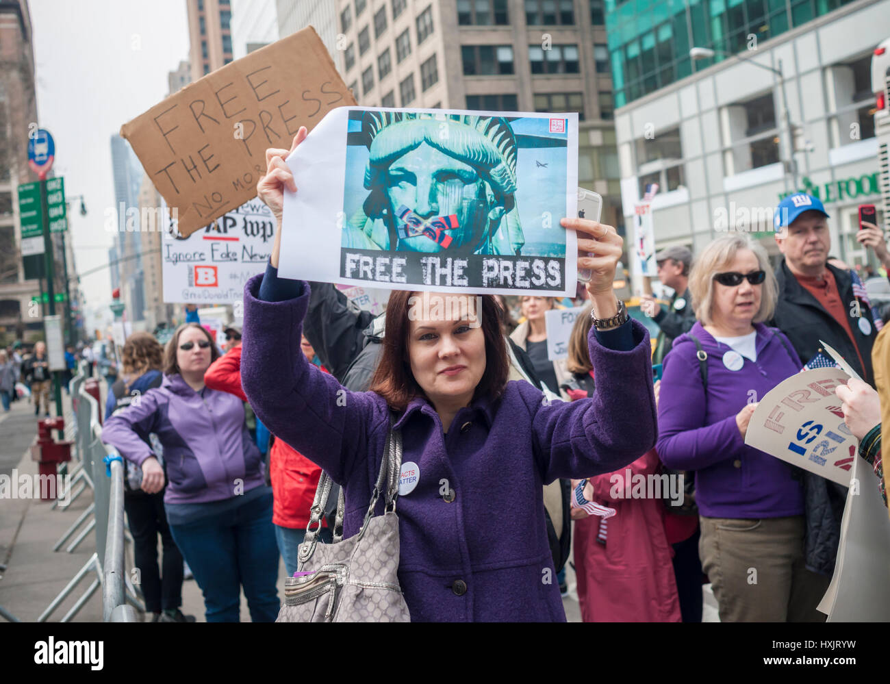 Activists rally in Bryant Park in New York prior to marching to the New ...