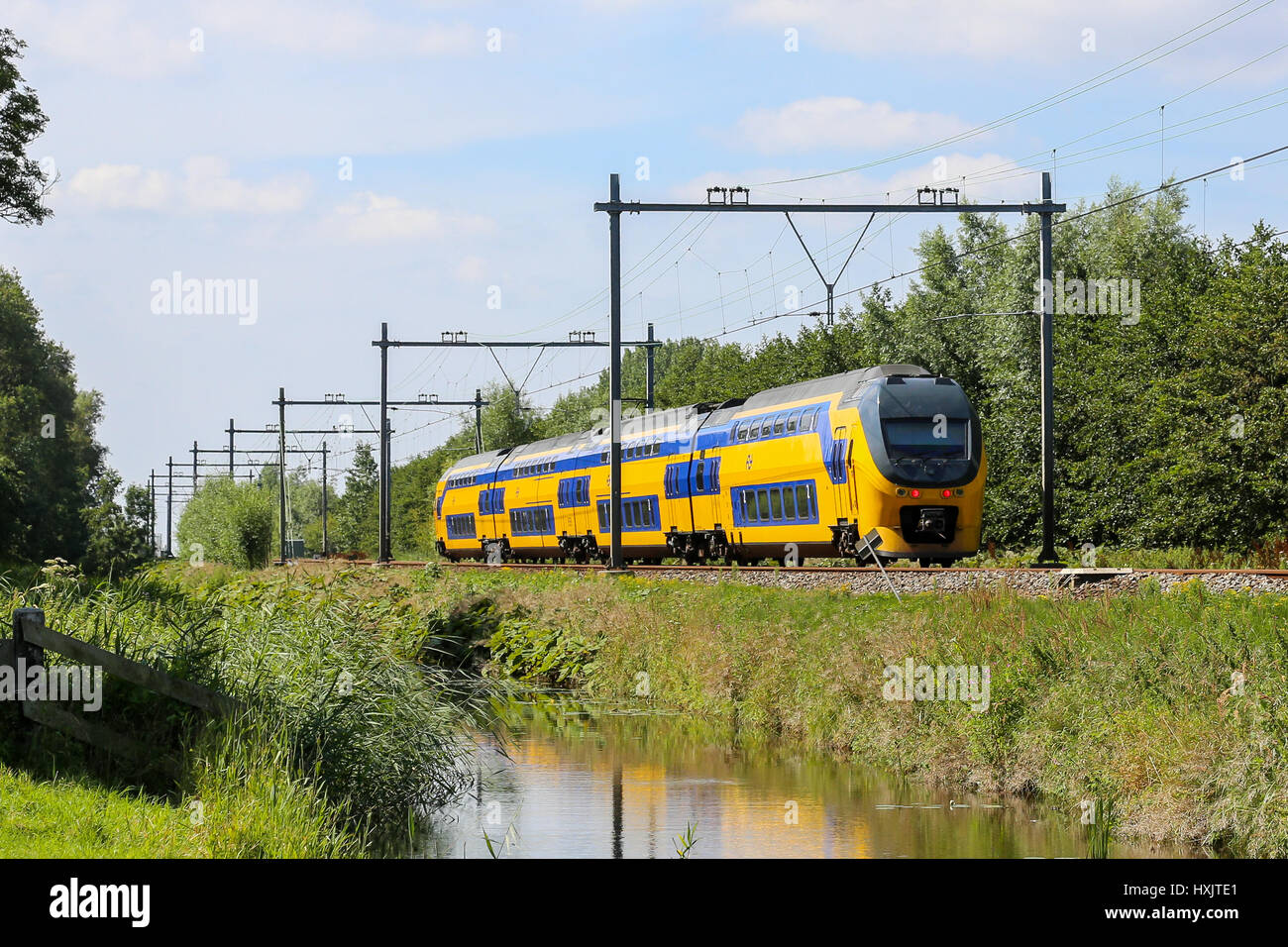 LISSE, NETHERLANDS - AUGUST 9, 2015: Dutch yellow and blue train ...