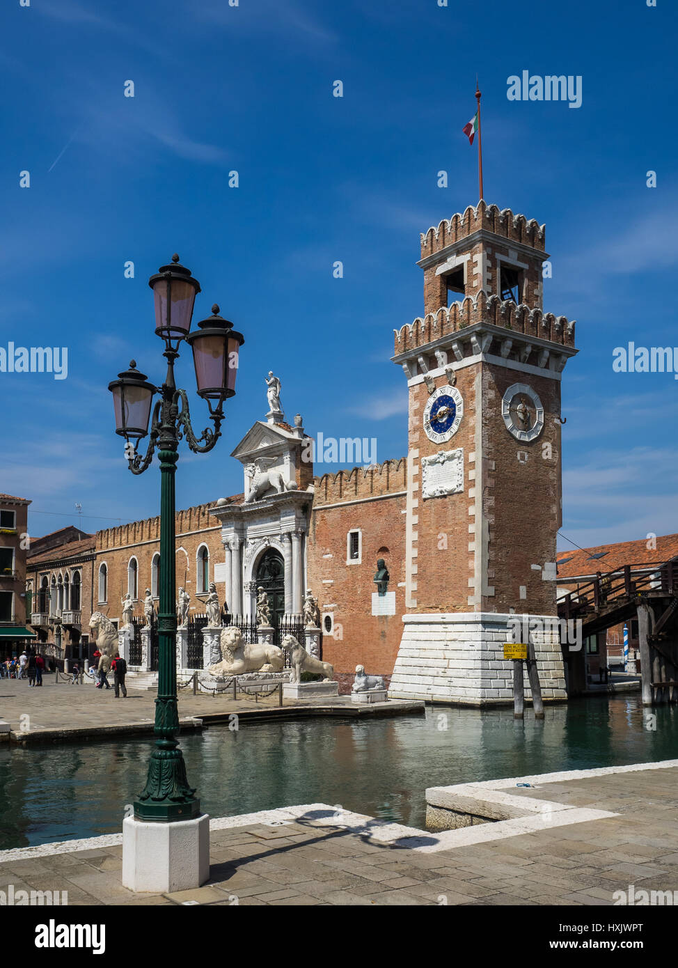 Venetian Naval Arsenal entrance gates with clock tower and canal ...