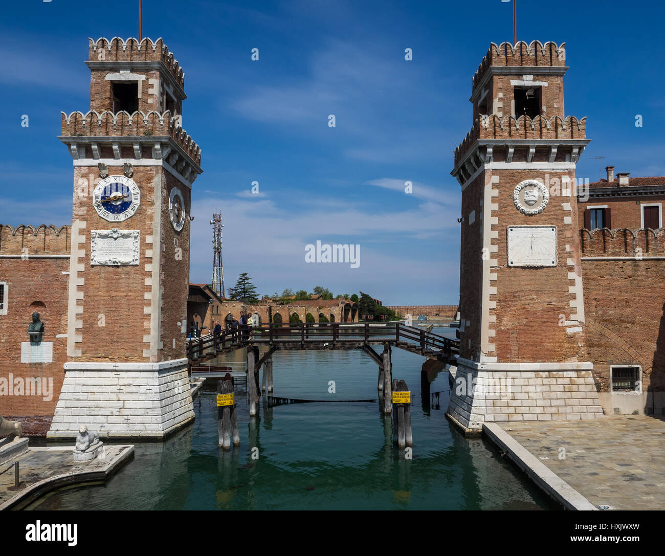 Venetian Naval Arsenal entrance gates with clock tower and canal ...
