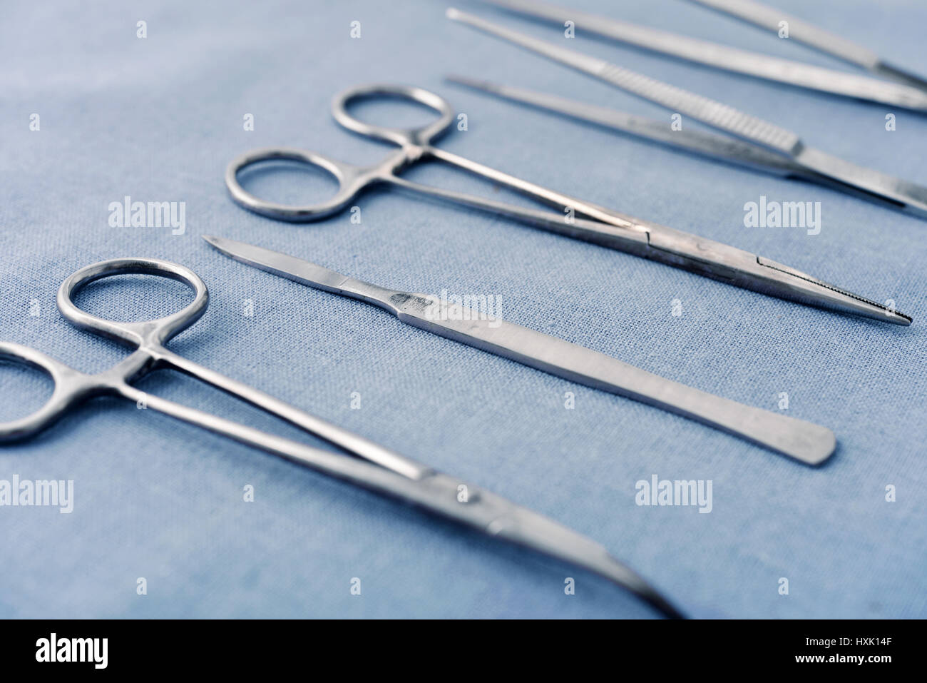 Old surgical instruments and tools including scalpels, forceps and ...