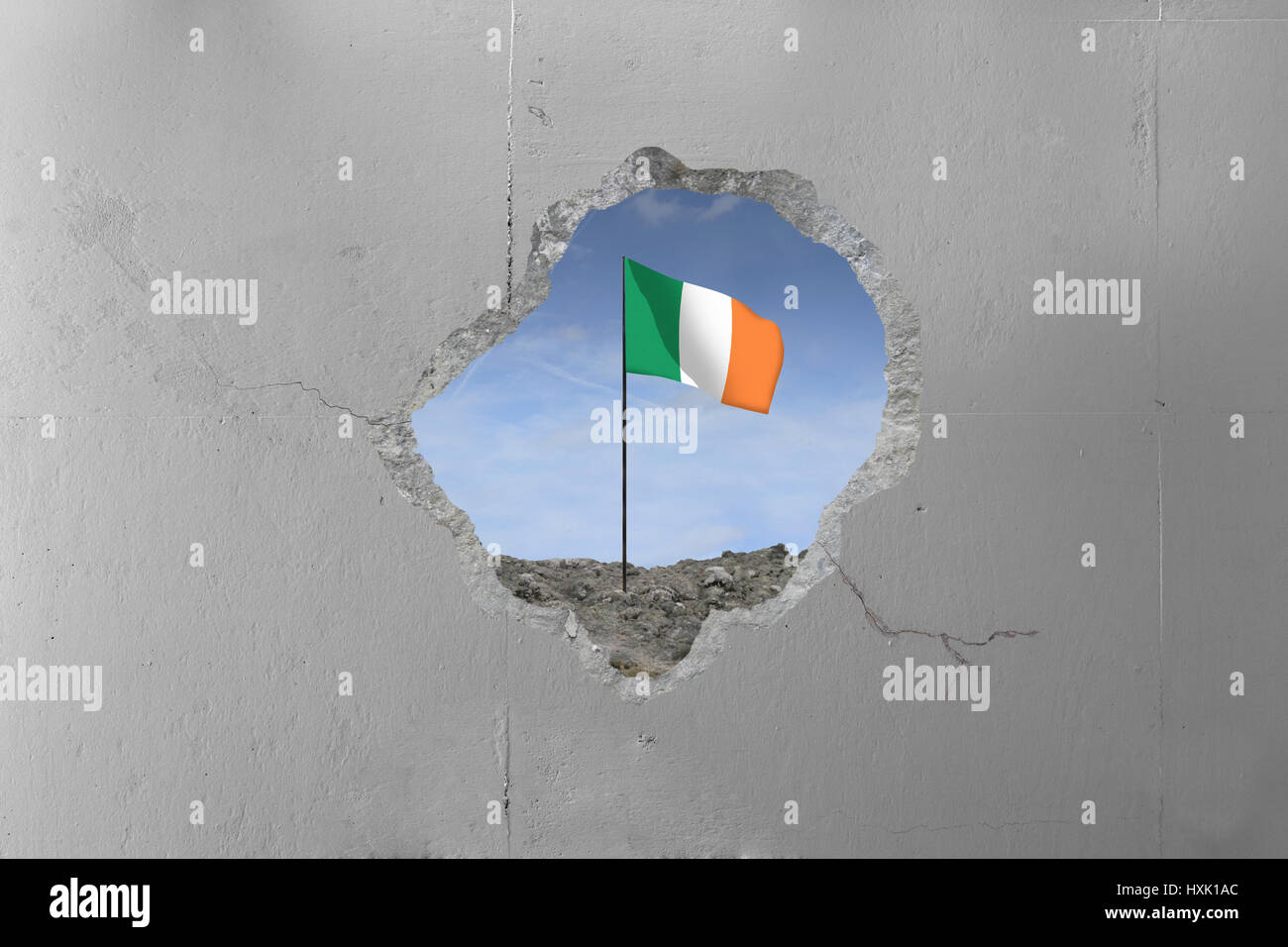 Ireland flag behind a concrete wall Stock Photo - Alamy