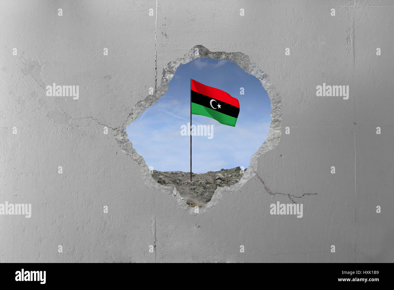 Libyan flag behind a concrete wall Stock Photo - Alamy