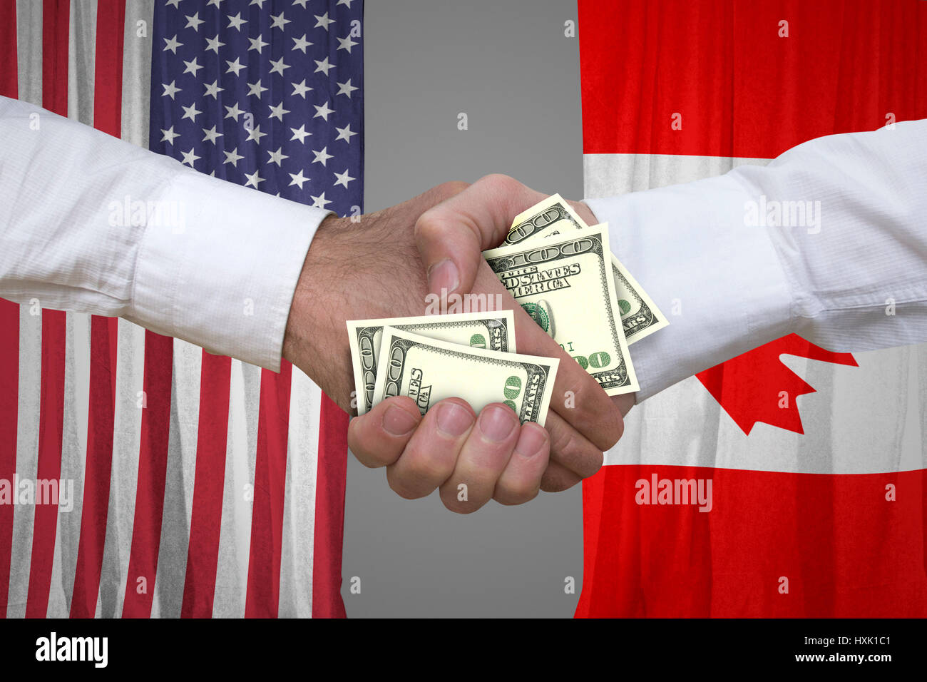 100 dollar bills handshake with USA and Canadian flags background Stock ...
