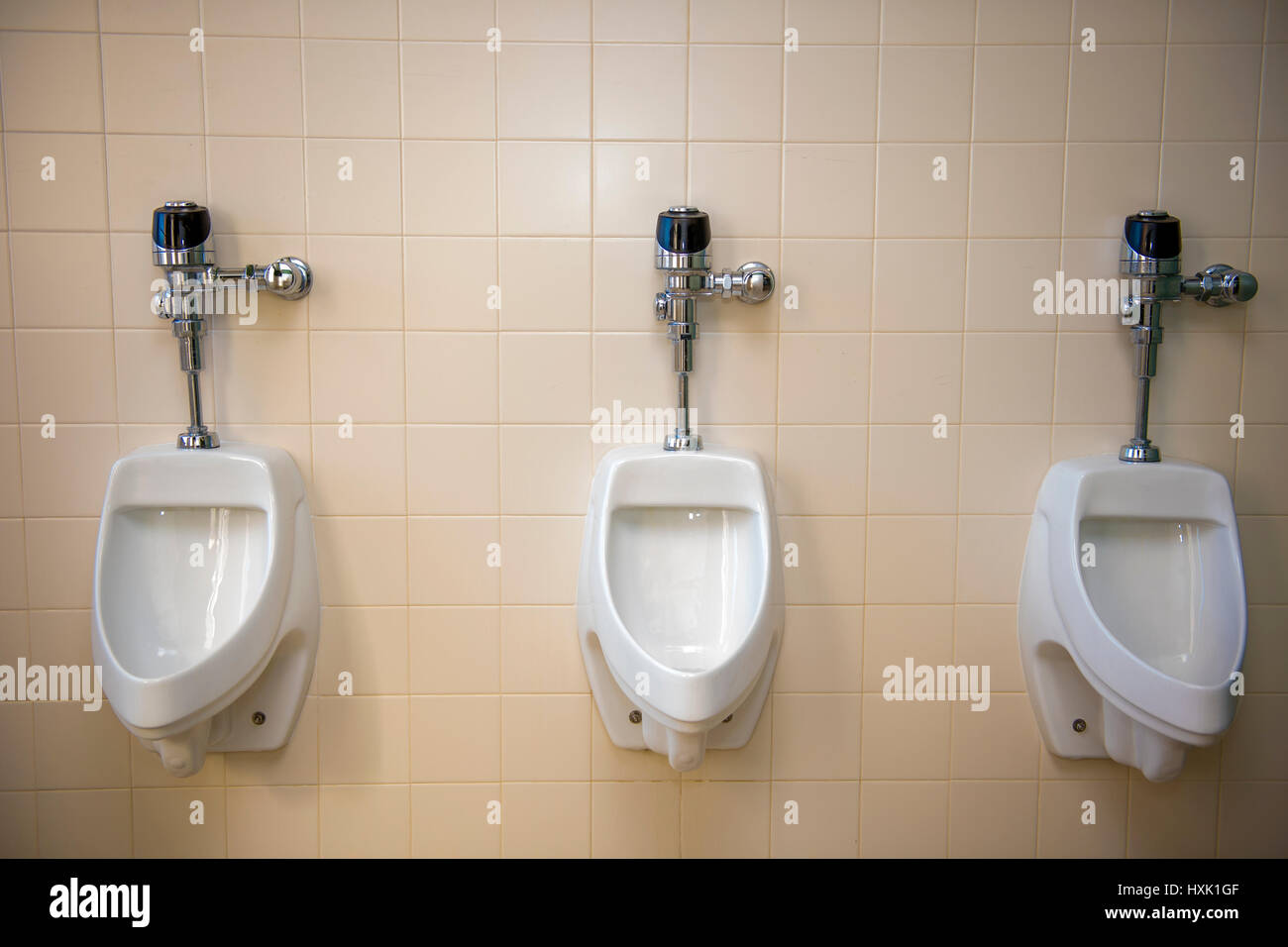 A set of urinals in a restroom Stock Photo - Alamy