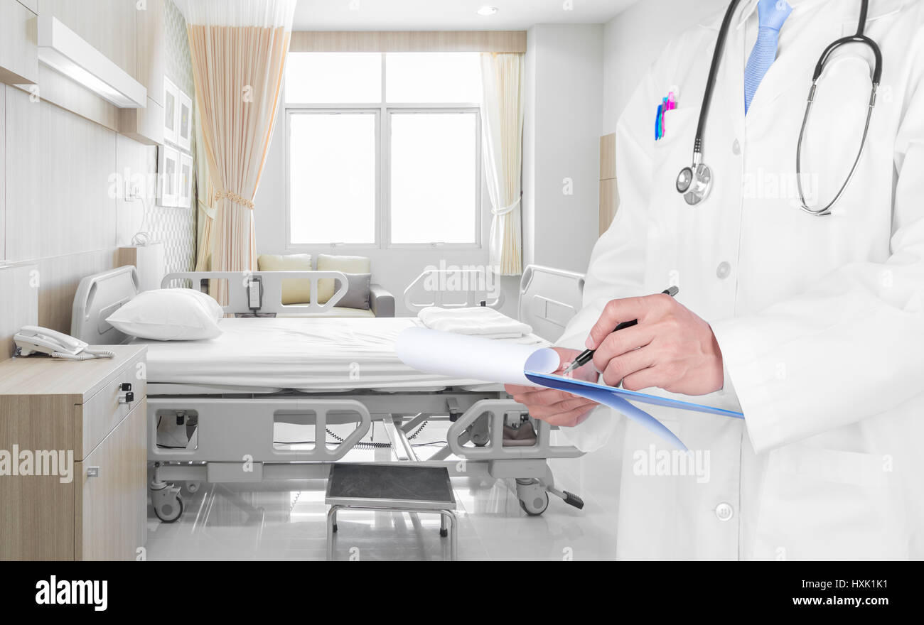 Doctor writing a medical prescription in hospital room Stock Photo - Alamy