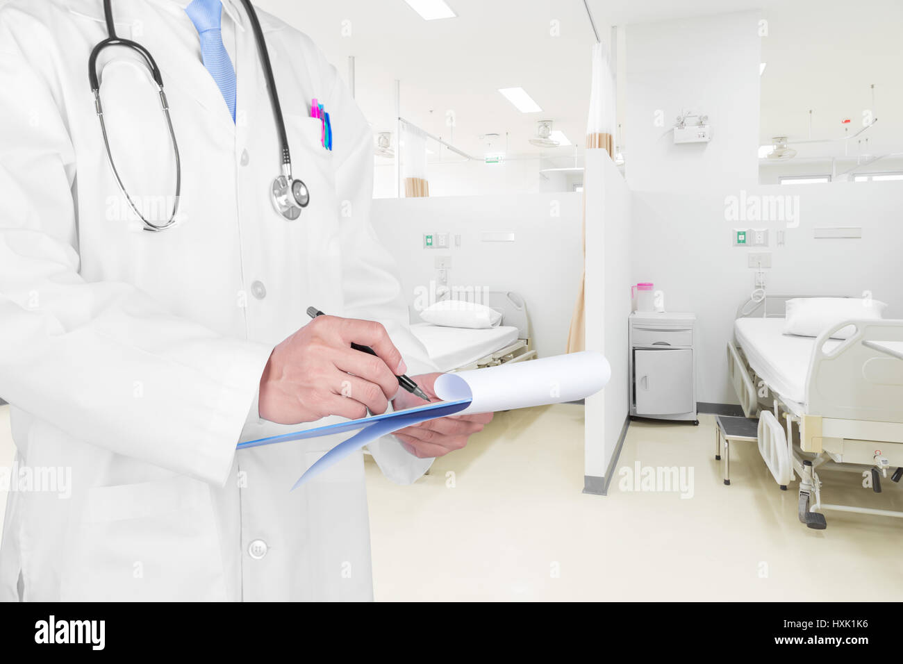 Doctor writing a medical prescription with medical background Stock ...