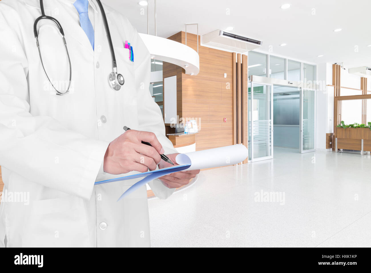 Doctor writing a medical prescription with medical background Stock ...