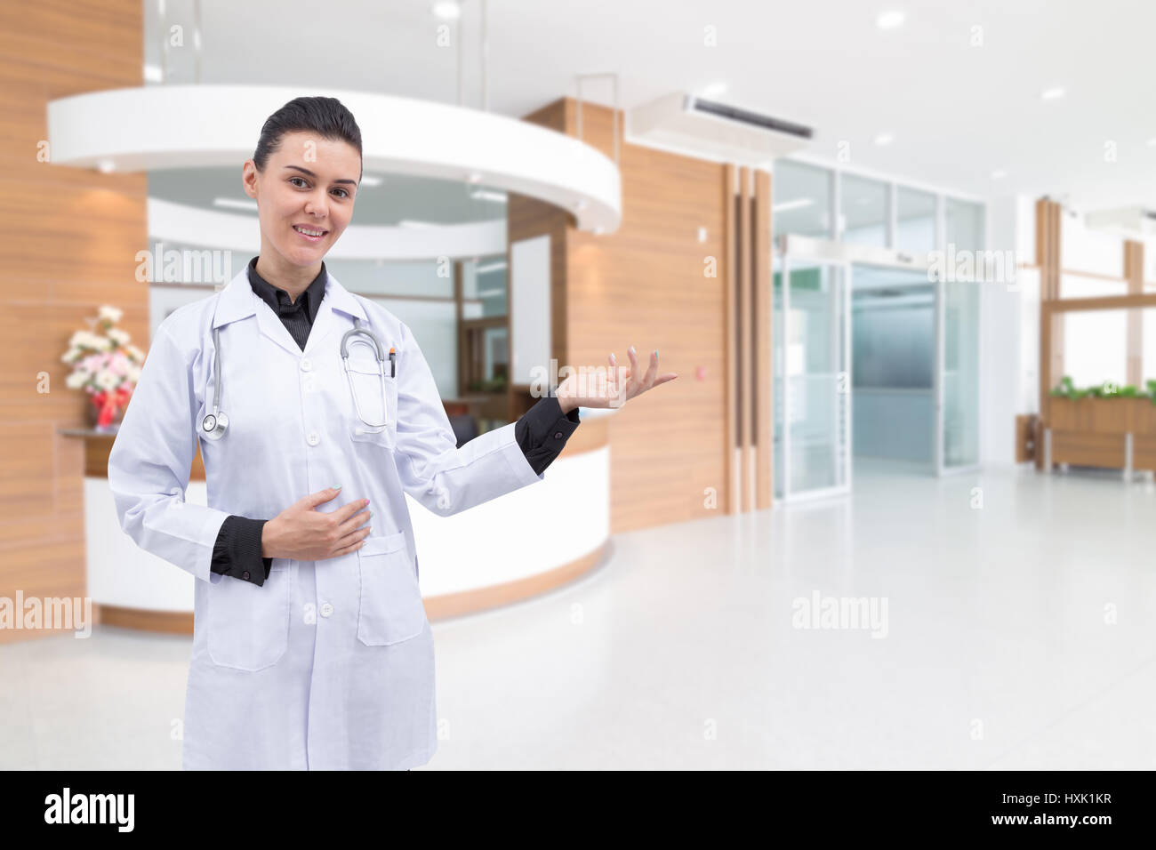 Beautiful female doctor reception in front of hospital Stock Photo - Alamy