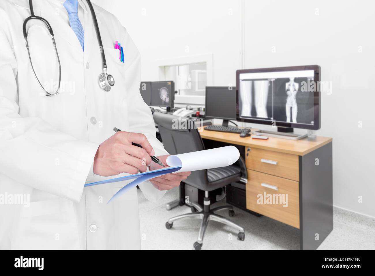 Doctor writing a medical prescription with medical background Stock ...