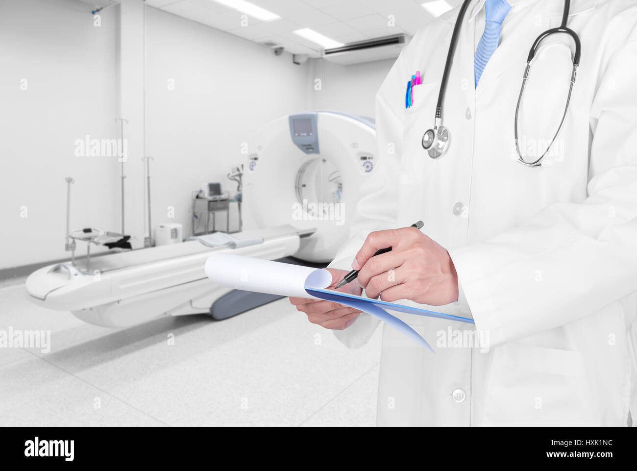 Doctor writing a medical prescription with medical background Stock ...