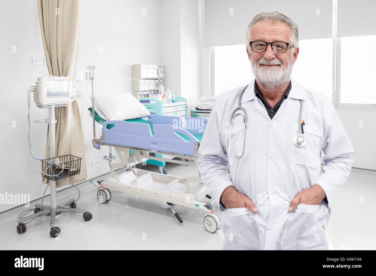 Senior doctor smile in the hospital room Stock Photo - Alamy