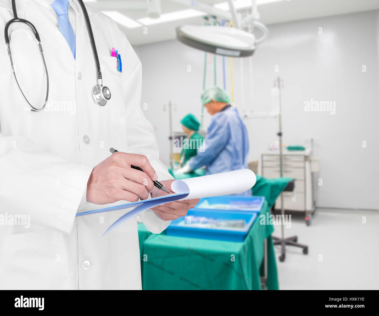 Doctor writing a medical prescription with medical background Stock ...