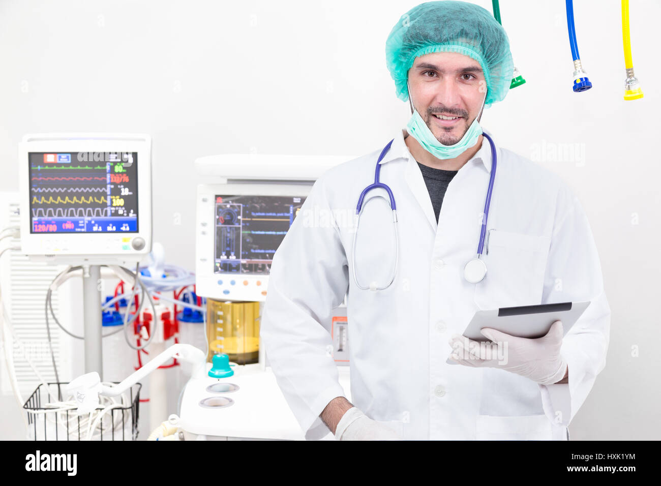 Doctor using tablet computer in operating room Stock Photo - Alamy