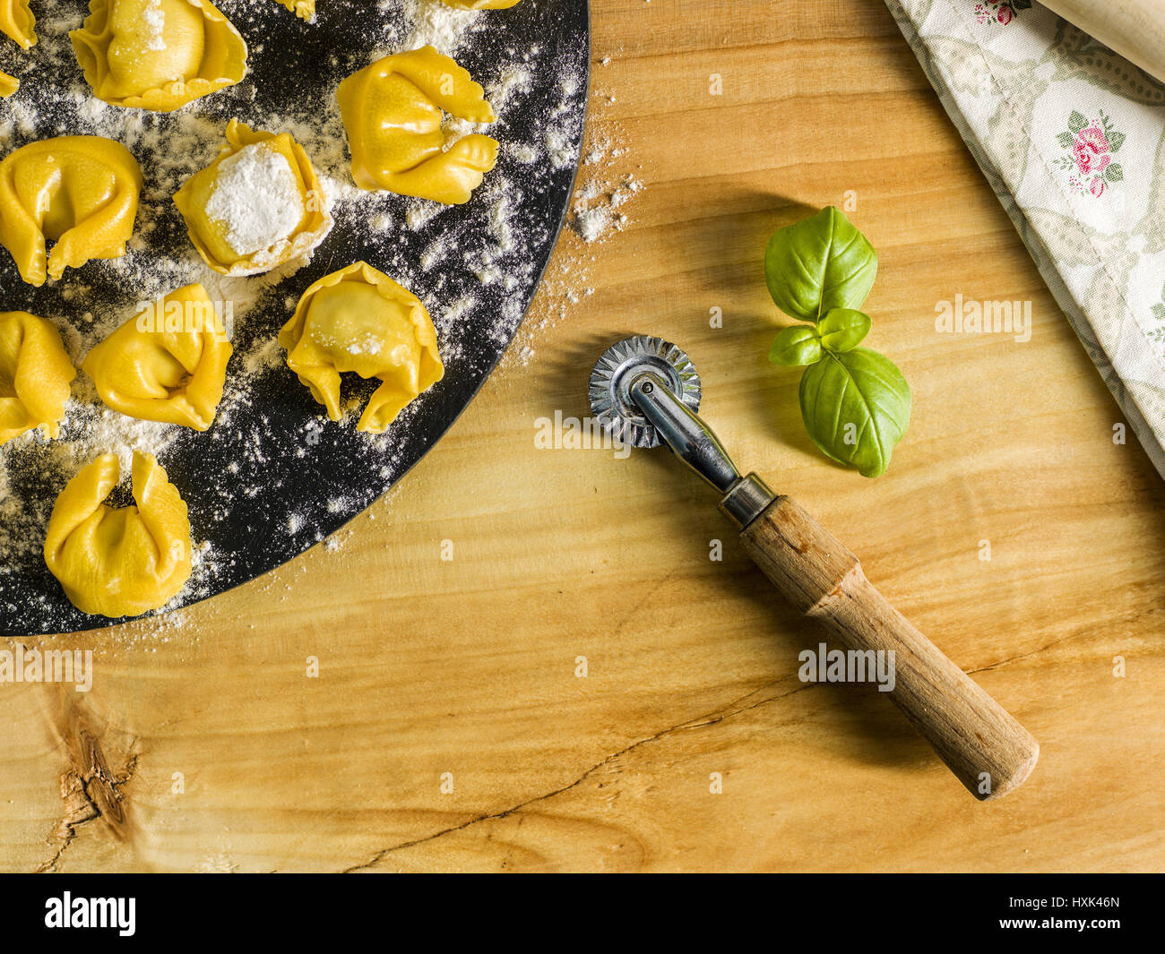 homemade Tortellini stuffed over a black stone ardesian Stock Photo - Alamy