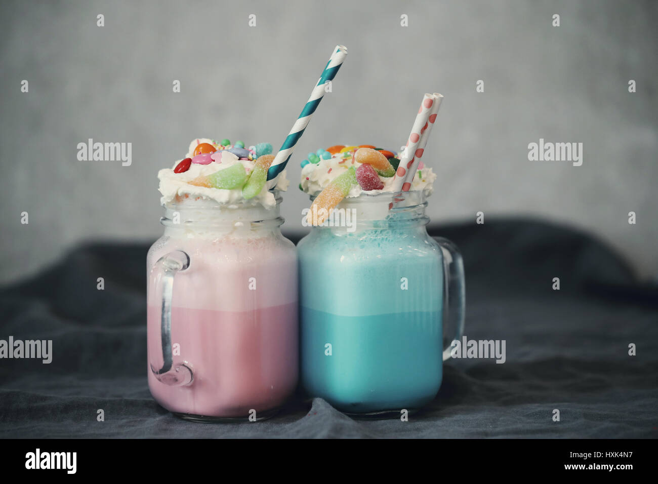 Glass pink milkshake decorated candy hi-res stock photography and ...