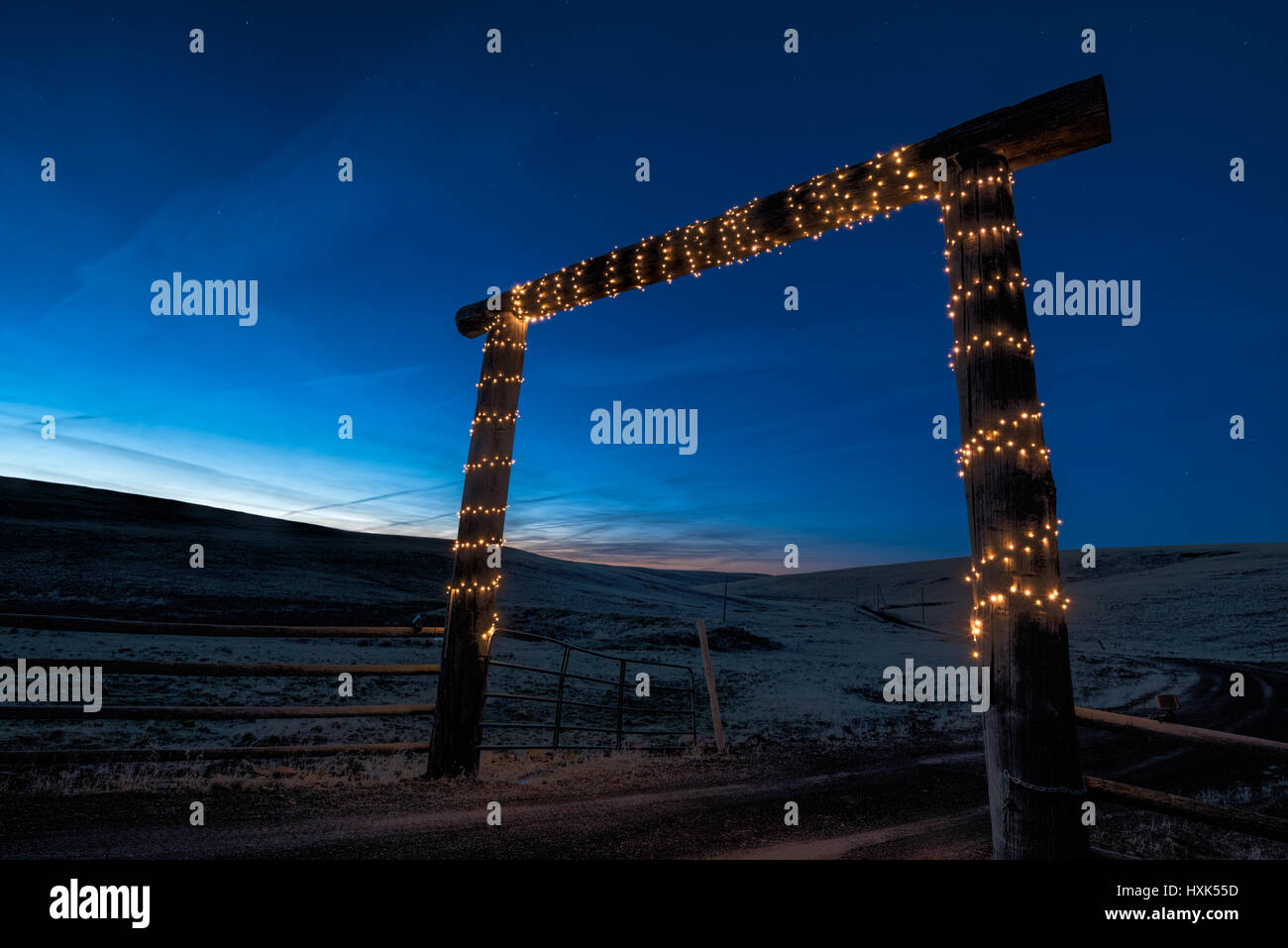Ranch headgate with string lights at dusk, Zumwalt Prairie, Oregon ...