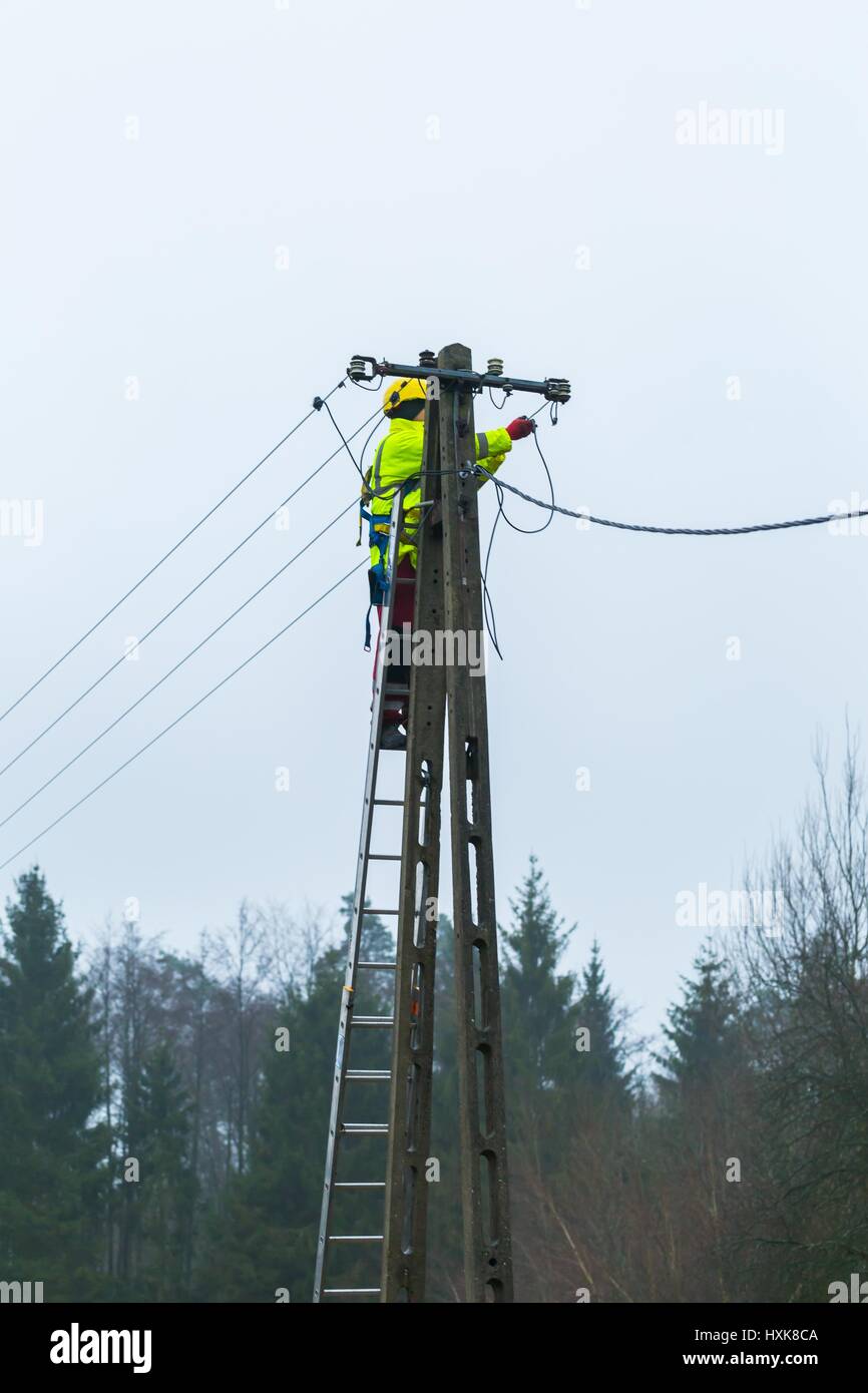 Electrician working on power lines. Failure of power lines on power ...