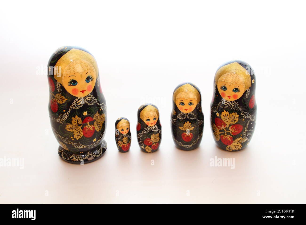 Five babushka dolls on a white background in landscape format with copy ...