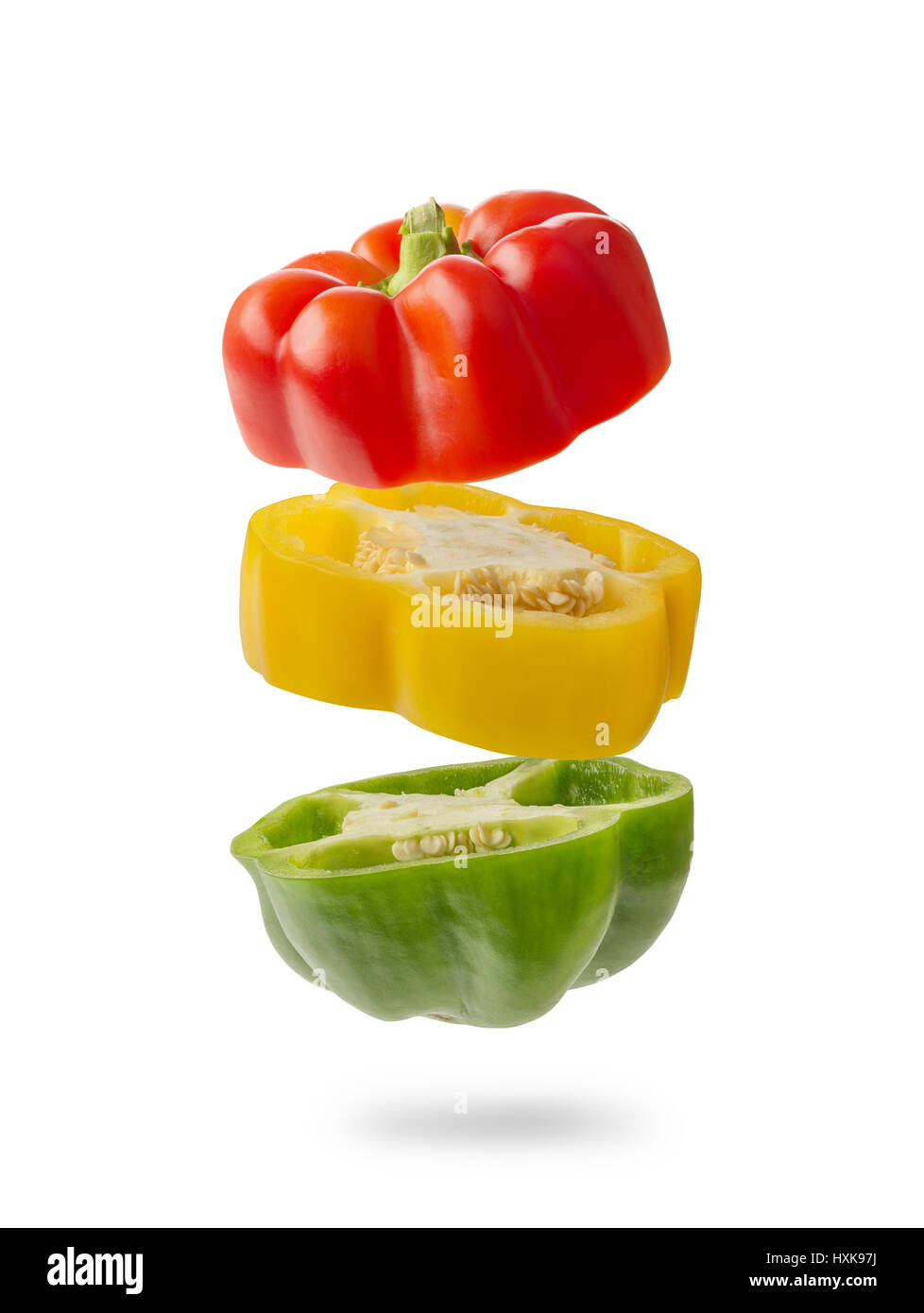 sliced and falling multicolored peppers isolated on white background ...